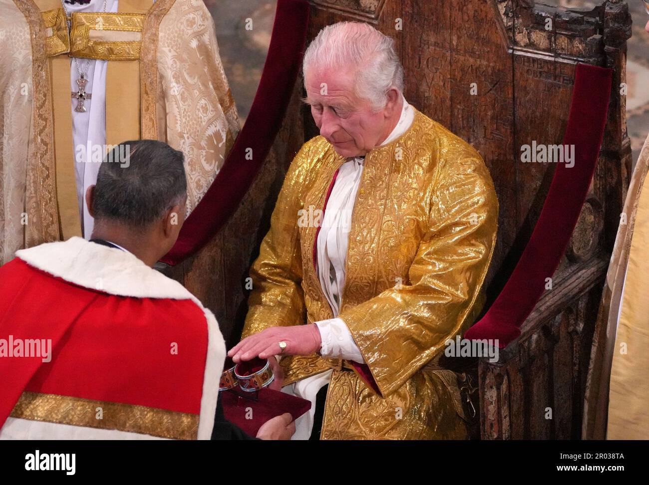 King Charles III holding the Armills during his coronation ceremony in ...