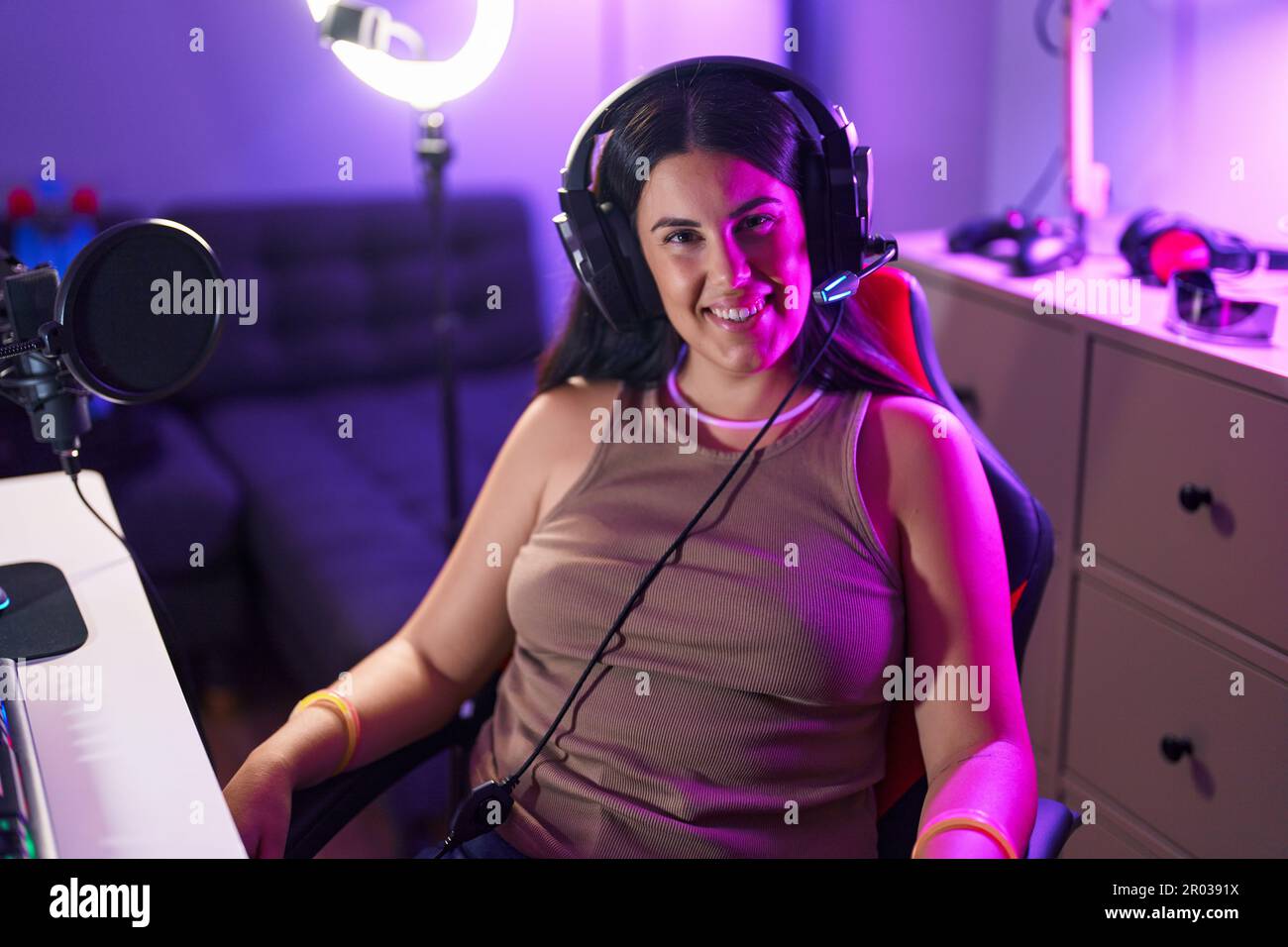 Young beautiful hispanic woman streamer smiling confident sitting on ...