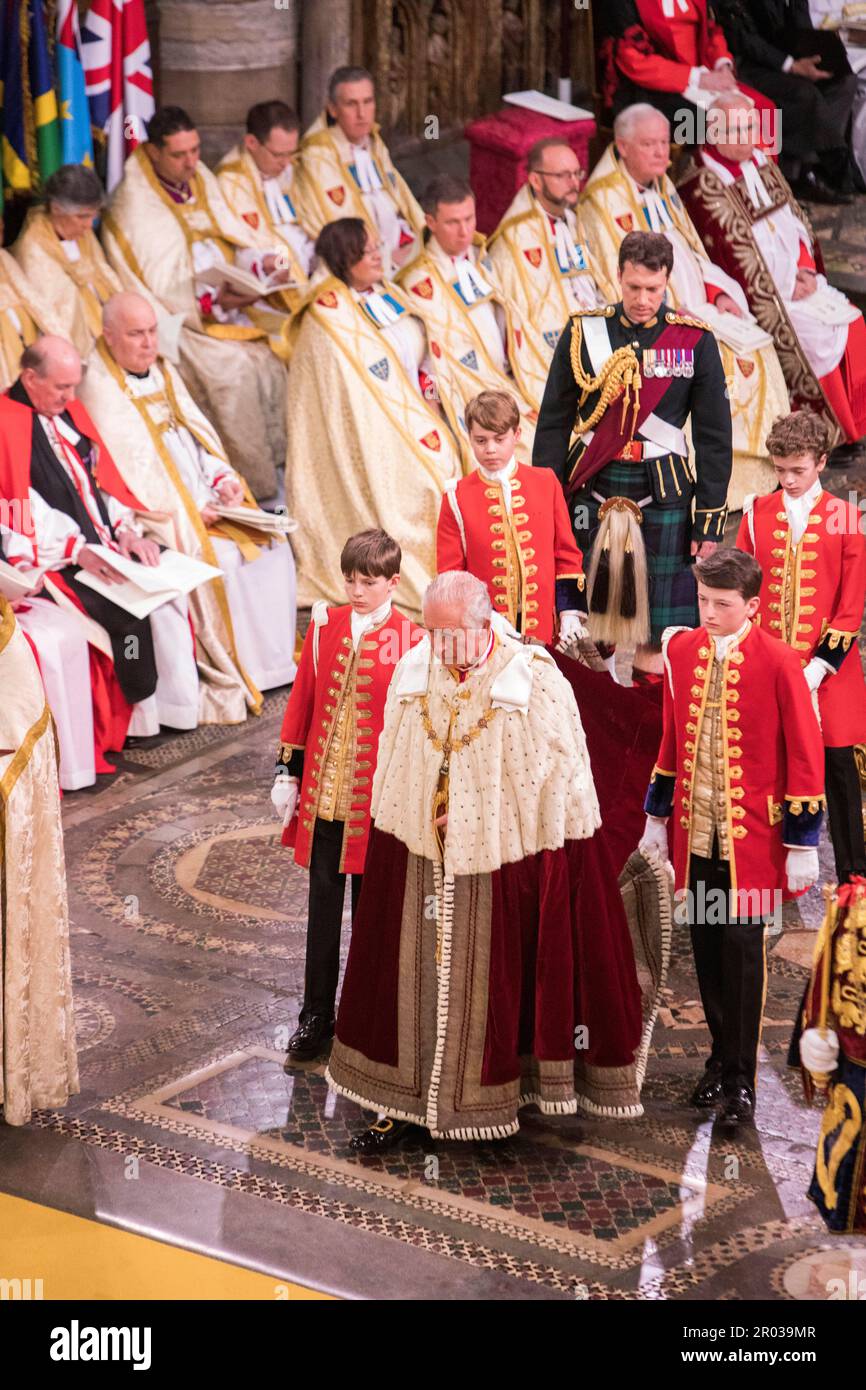 King Charles III stands up prior to being coronated, during his ...