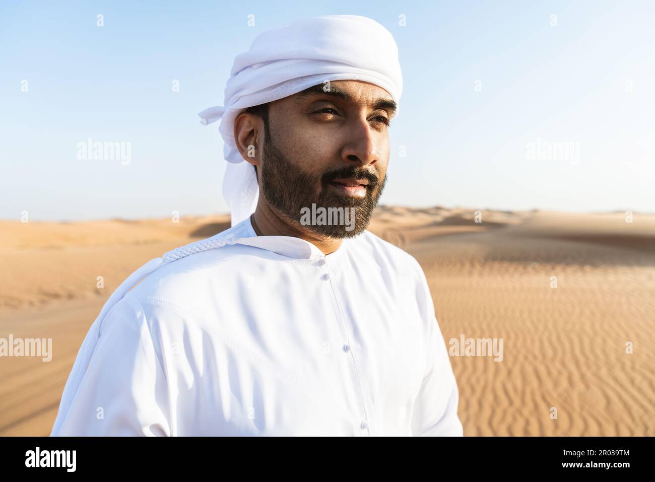 Handsome and successful middle-eastern man wearing traditional emirati ...