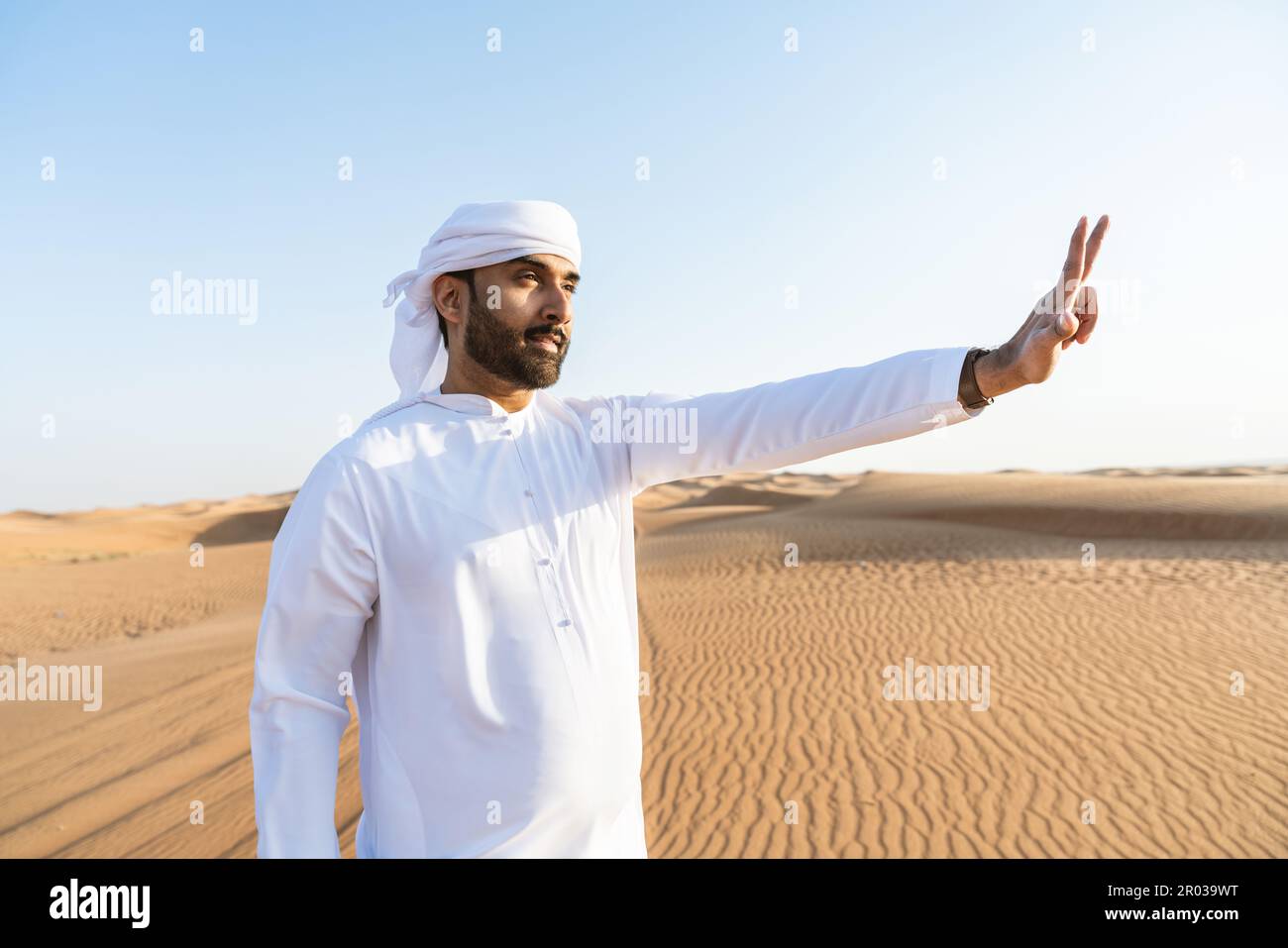 Handsome and successful middle-eastern man wearing traditional emirati ...