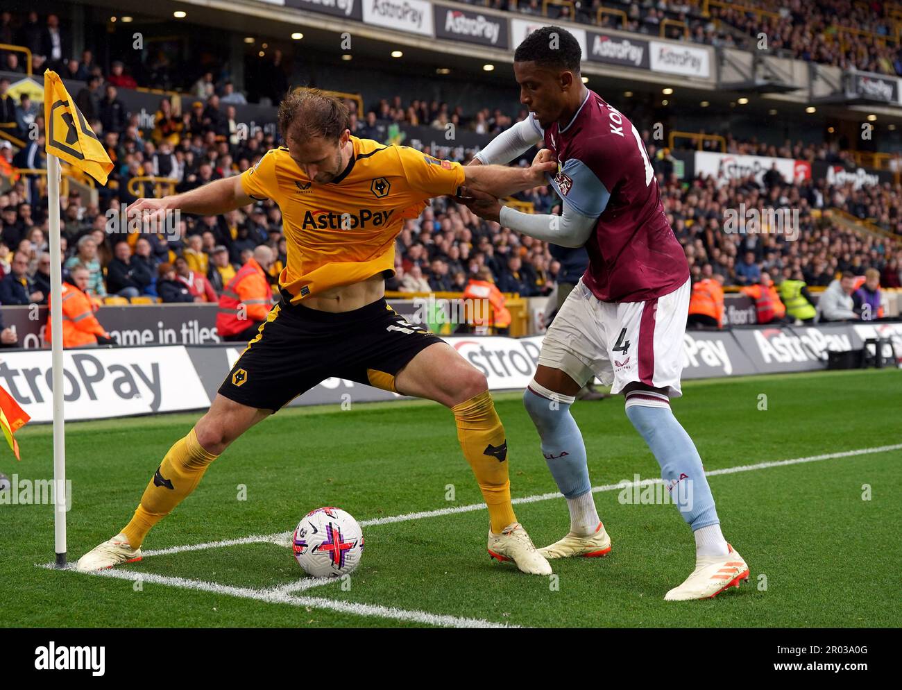Wolverhampton Wanderers' Craig Dawson holds off Aston Villa's Ezri ...
