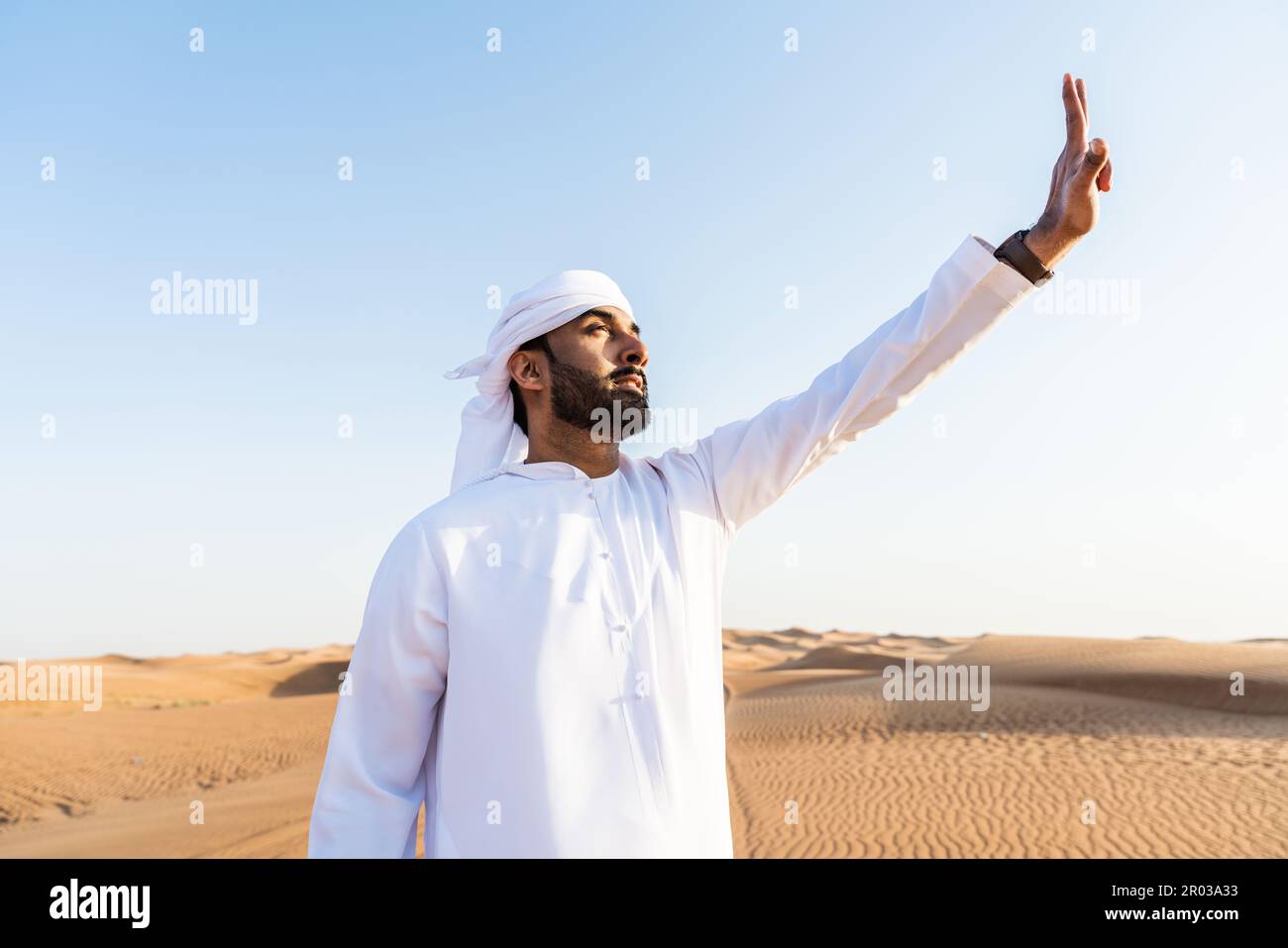 Handsome and successful middle-eastern man wearing traditional emirati ...