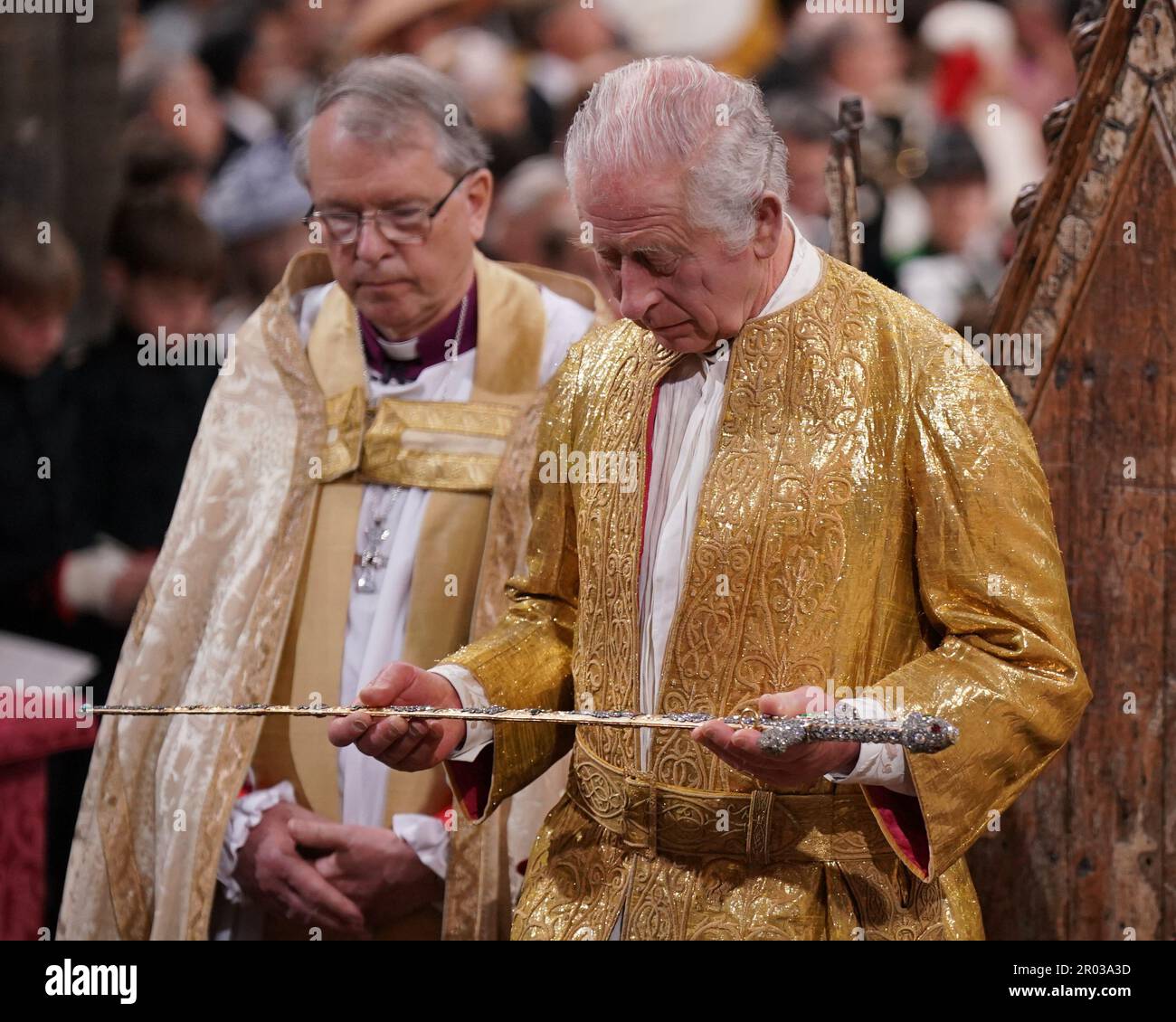 King Charles III holding the Sword of State during his coronation ...