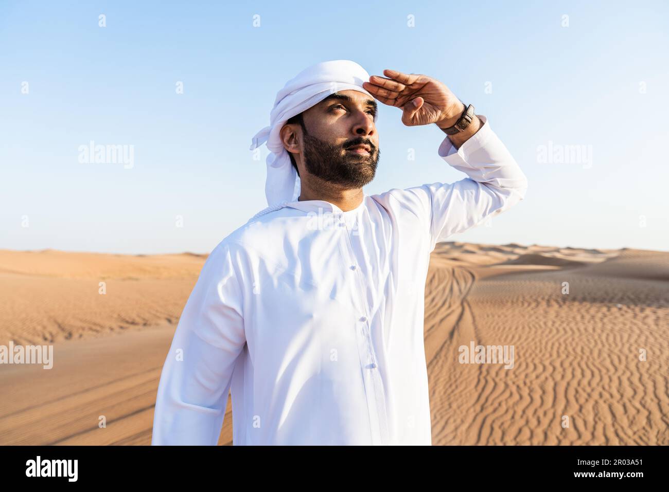 Handsome and successful middle-eastern man wearing traditional emirati ...