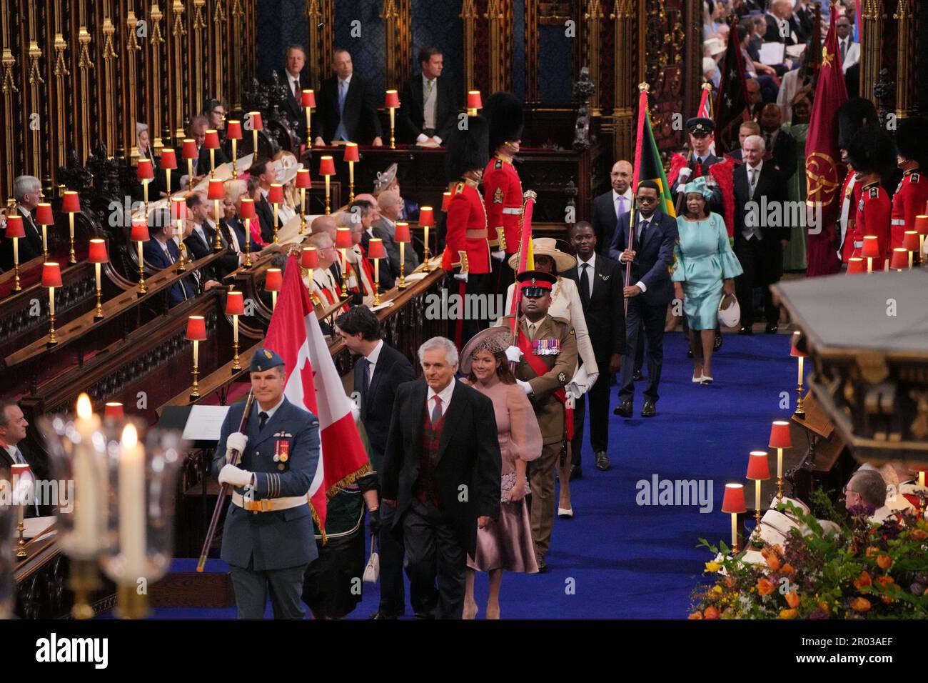 Representatives from the King's Realms, bearing the national flags, accompanied by Governors ...