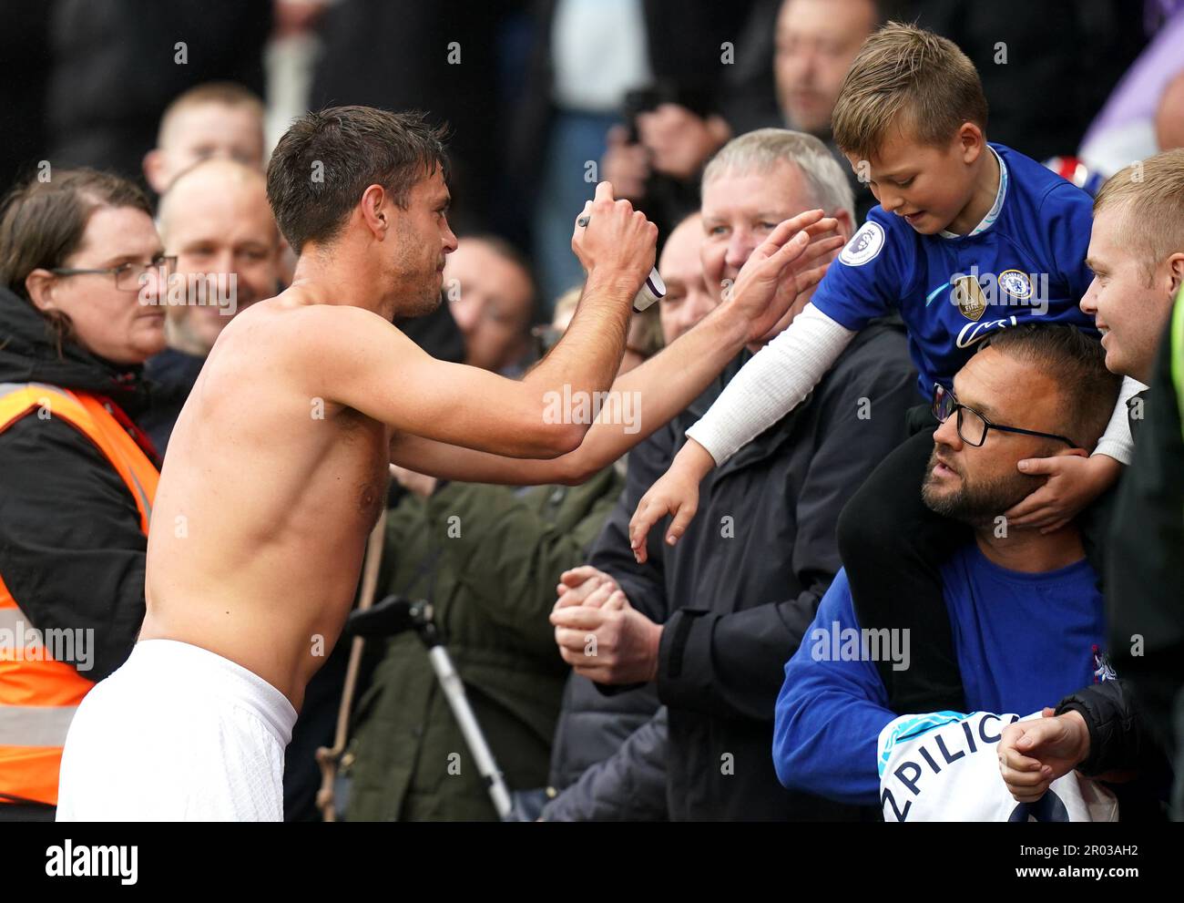 Chelsea's Cesar Azpilicueta signs an autograph for a young fan after ...