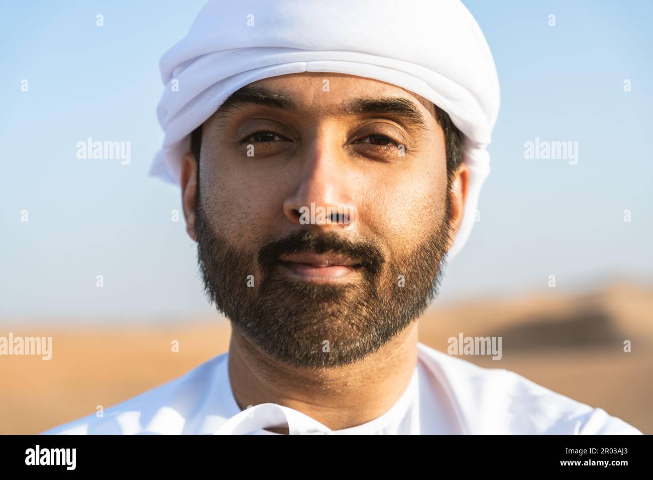 Handsome and successful middle-eastern man wearing traditional emirati ...