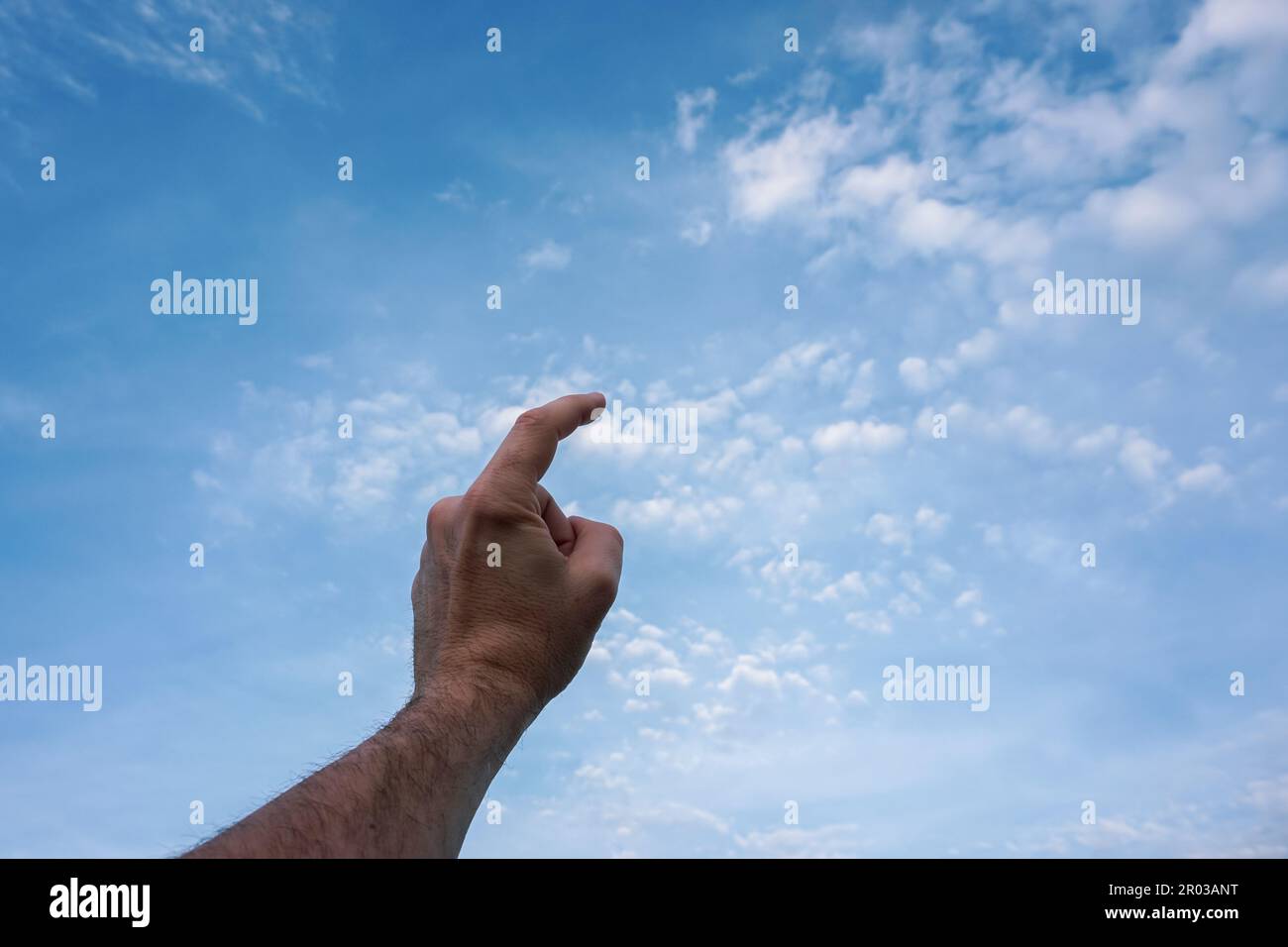 hand up gesturing in the blue sky, feelings and emotions Stock Photo ...