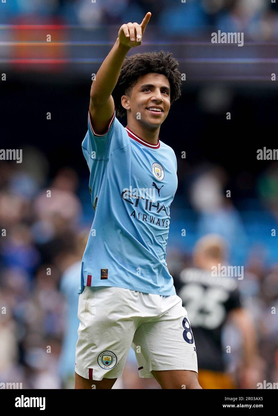 Manchester City’s Rico Lewis points to fans following the Premier ...