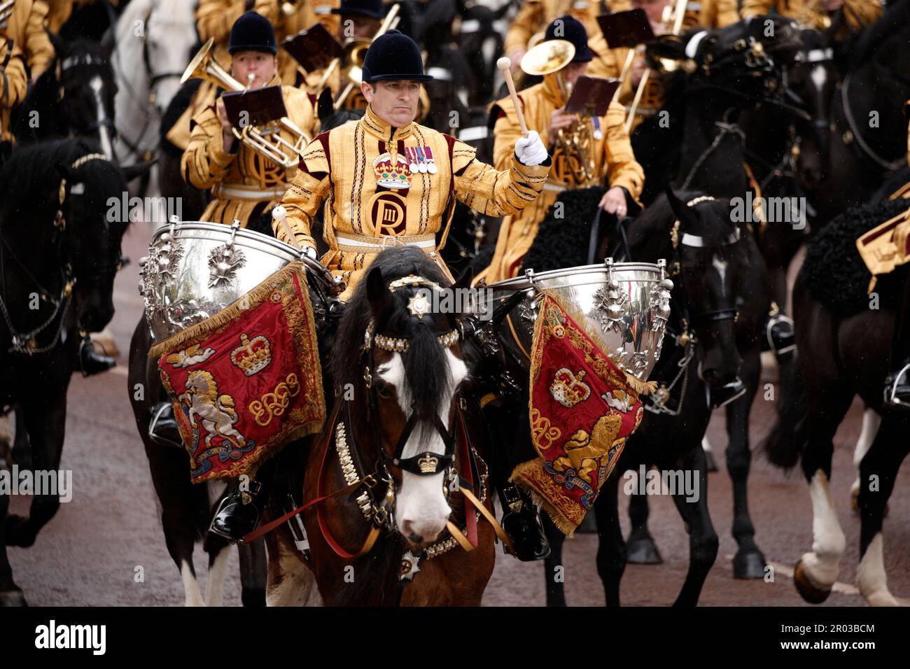 A soldier rides on a and perform in the procession of the coronation of ...