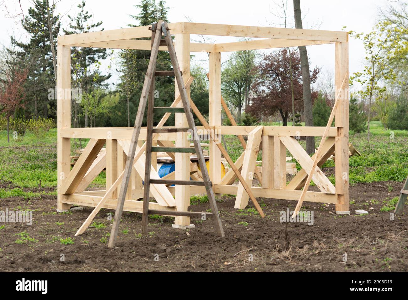 The frame of a wooden gazebo. Construction of a gazebo in a city park ...