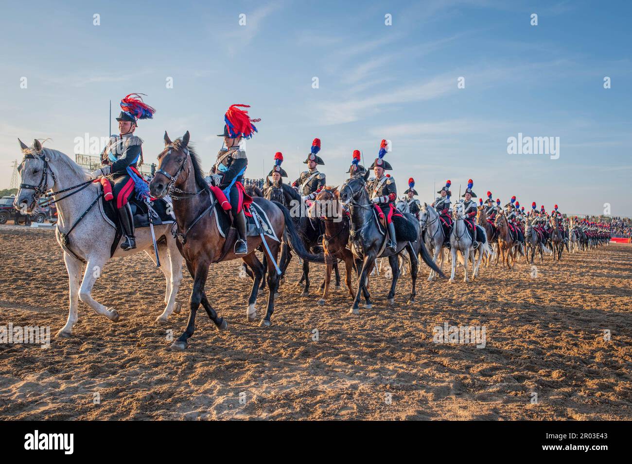 The long line of Carabinieri ride their horses as they leave the field ...