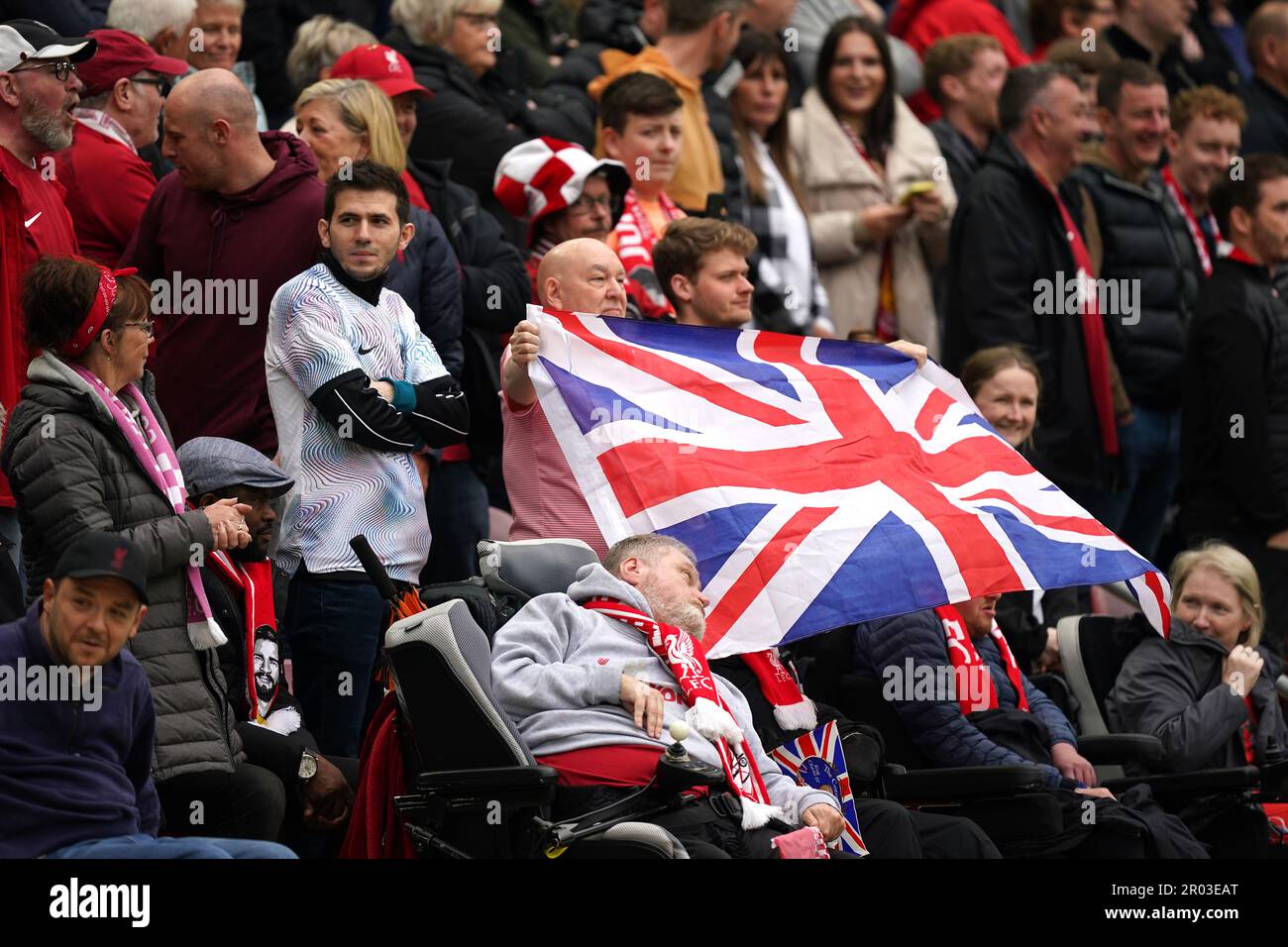 Liverpool fans hold up a flag of the Union Jack during the national ...
