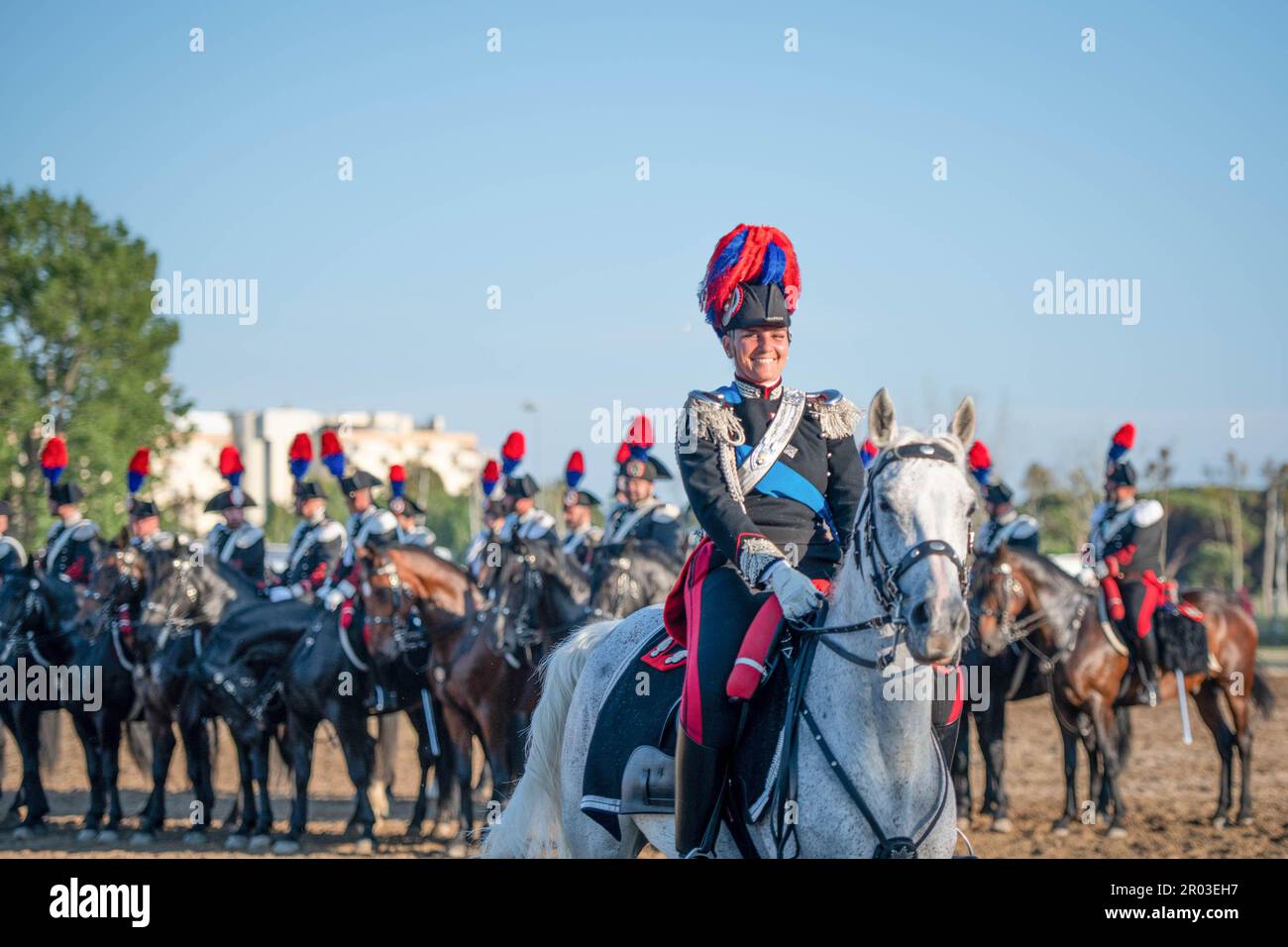 A smiling female Carabiniere rides her horse during the carousel for ...