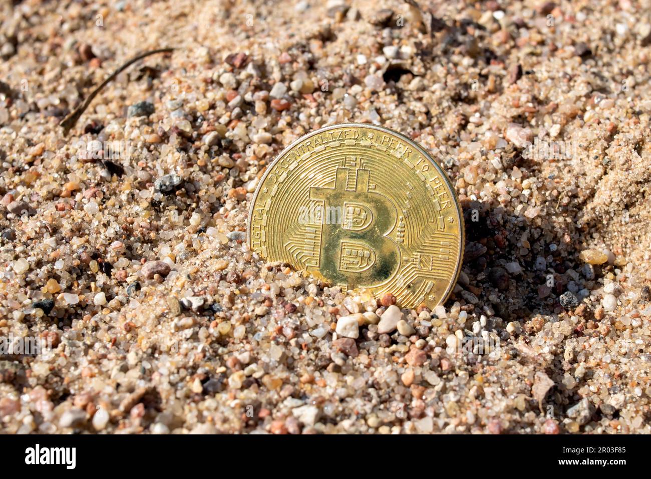 Bitcoin btc coin in sand hi-res stock photography and images - Alamy