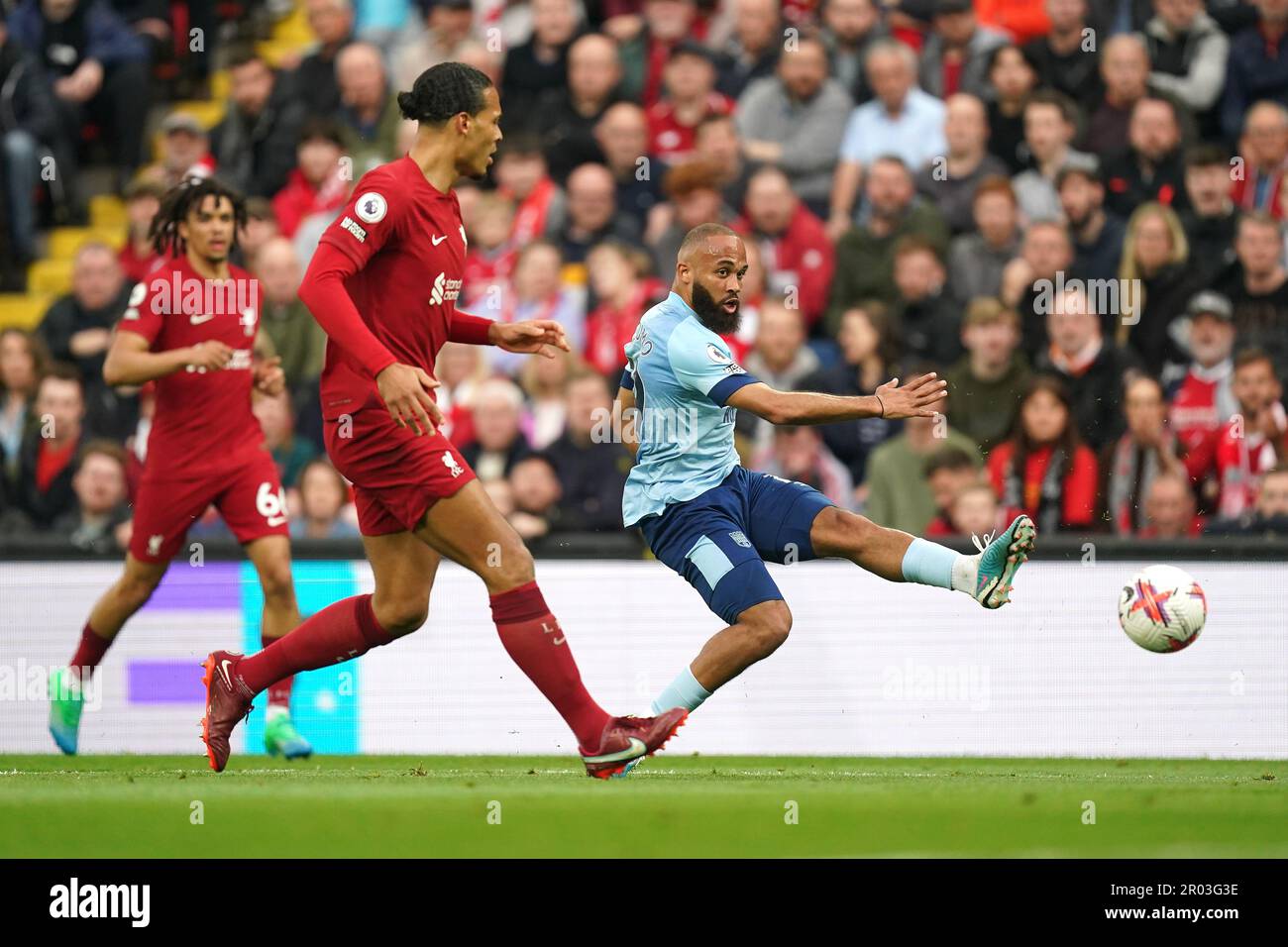 Brentford's Bryan Mbeumo (right) attempts a shot on goal during the ...