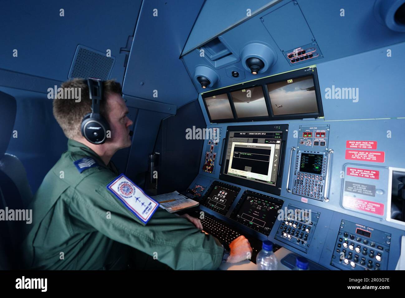 A crew member viewing screens inside an Royal Air Force (RAF) Voyager ...