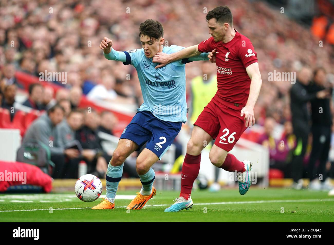 Brentford's Aaron Hickey (left) and Liverpool's Andrew Robertson battle ...