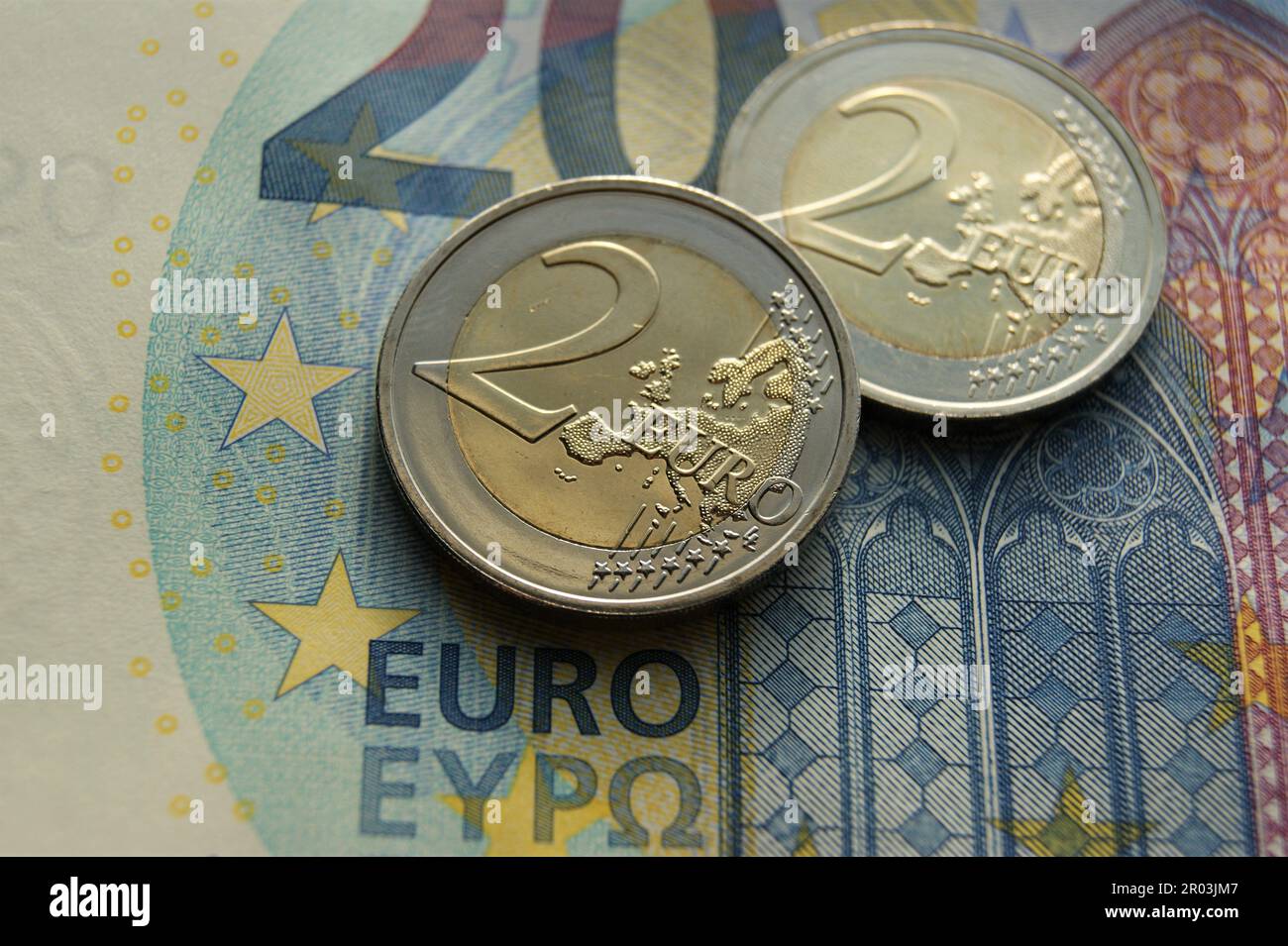 2 Euro coins on a banknote. European money Stock Photo - Alamy
