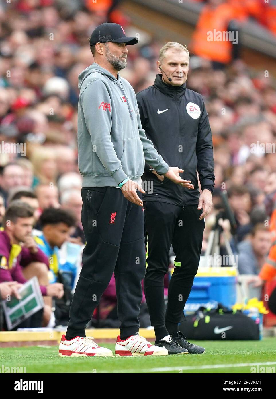 Liverpool manager Jurgen Klopp (left) speaks with fourth official ...
