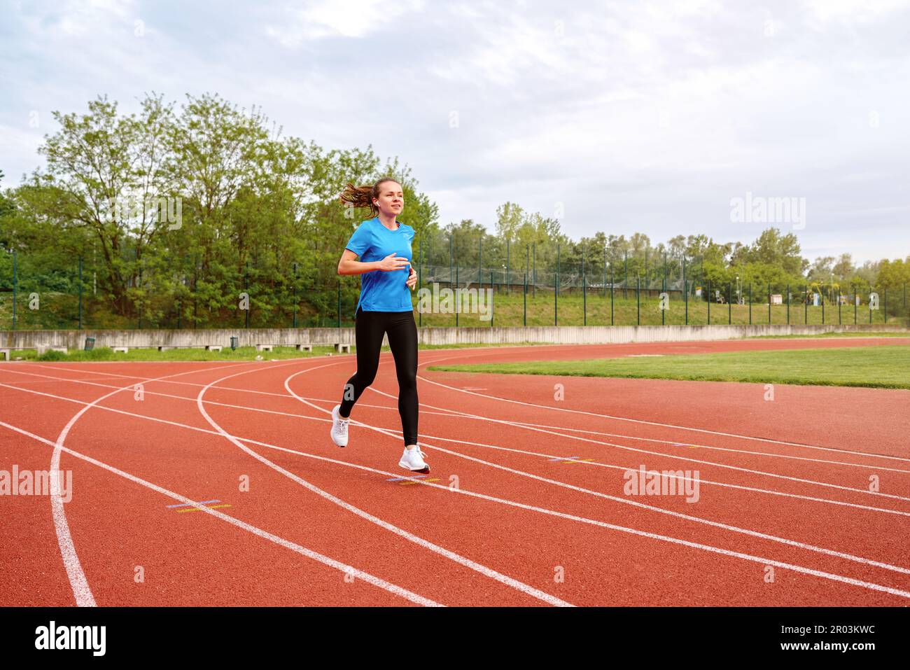 Female athlete running in track hi-res stock photography and images - Alamy