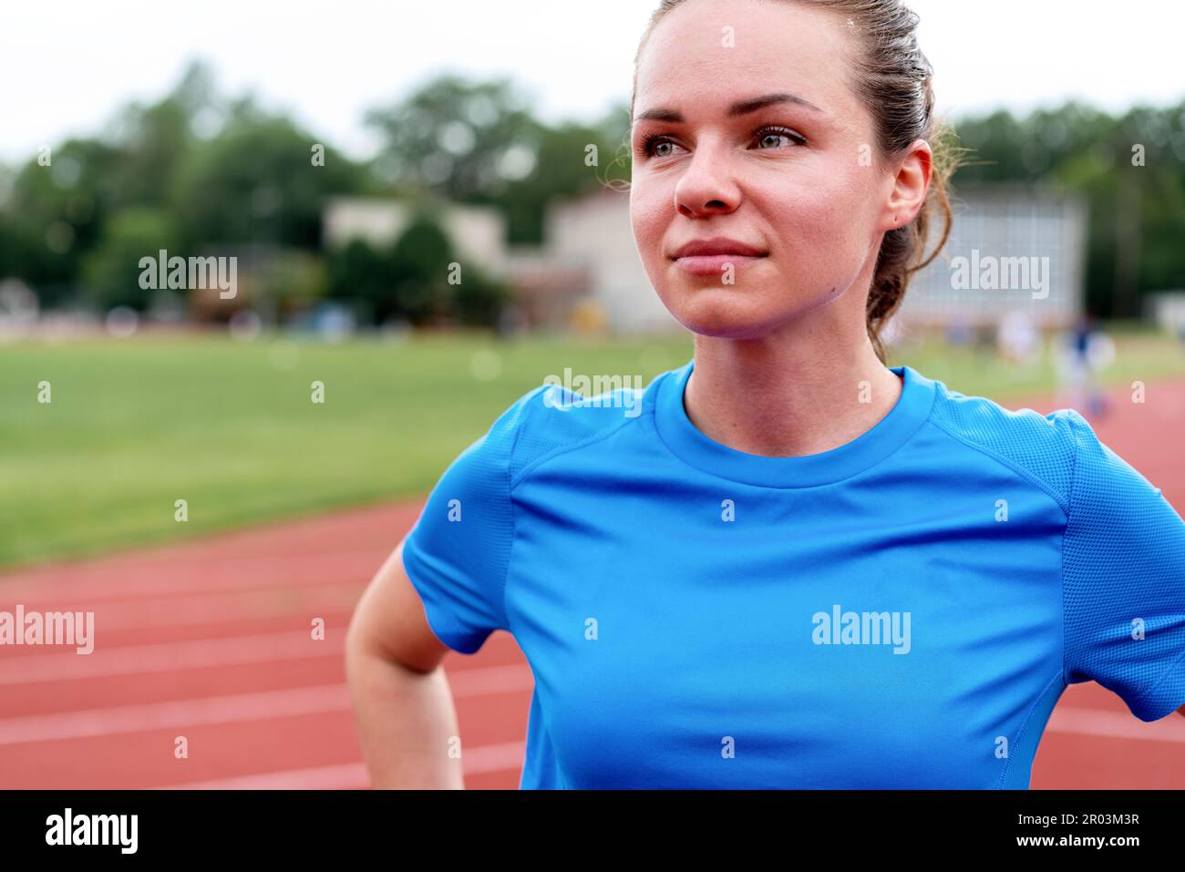 Portrait young female athlete after run Stock Photo - Alamy