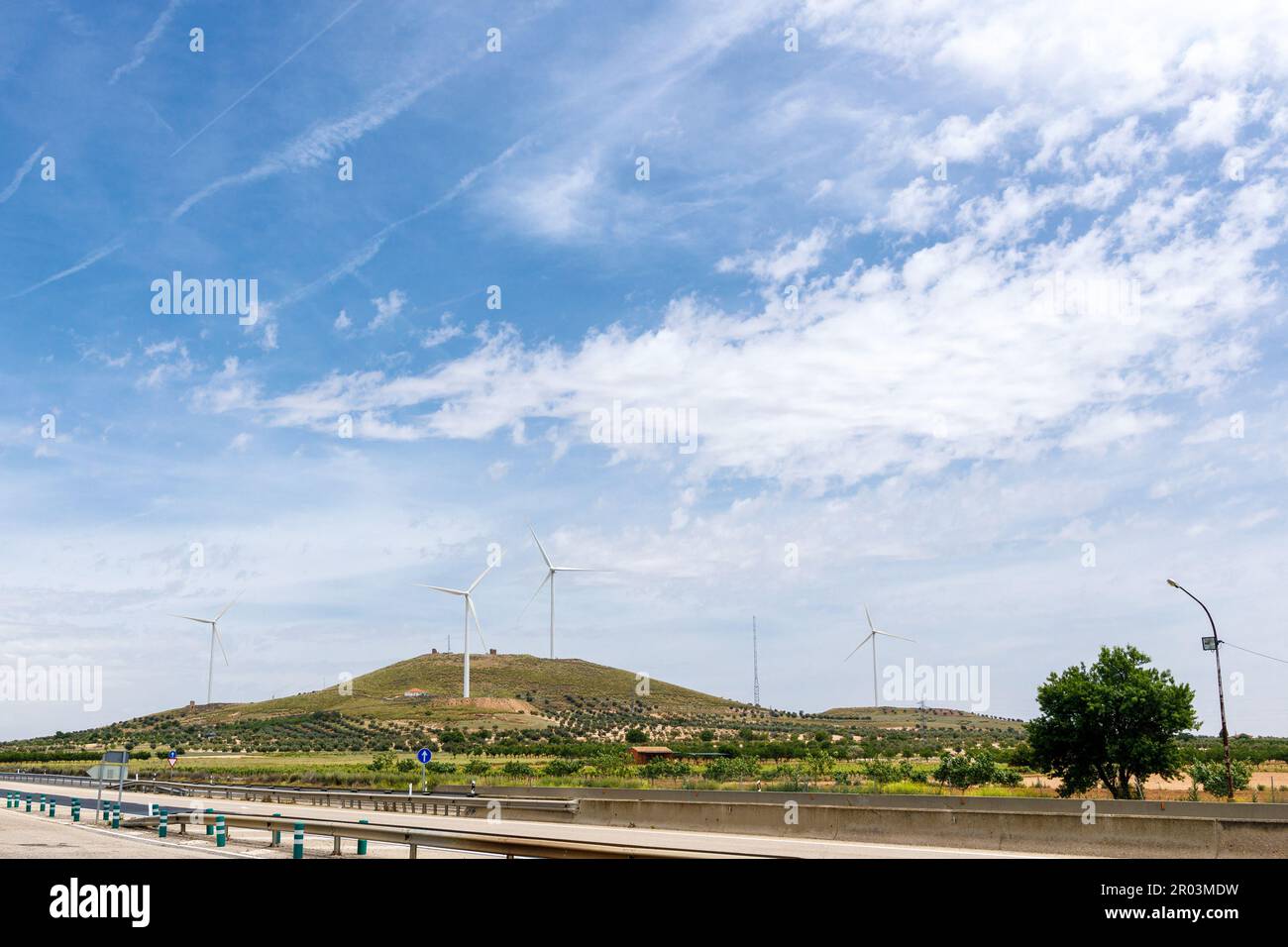 Wind turbines on the hill. Green energy, electricity generation, blue ...