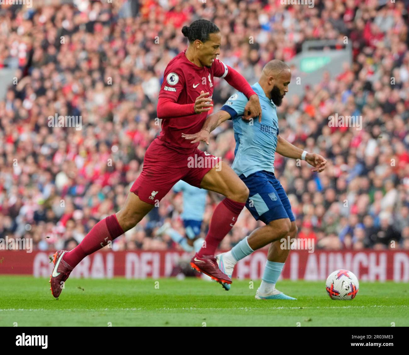 Virgil van Dijk #4 of Liverpool competes for the ball with Bryan Mbeumo ...