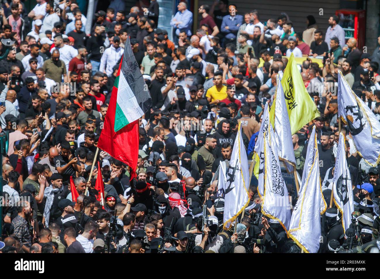 Nablus, Palestine. 06th May, 2023. Armed men wave the flags of the ...