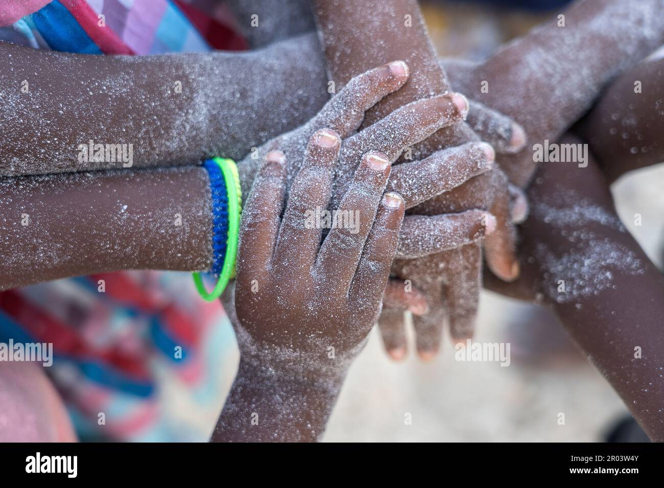 Arm stacked together one by one in unity and teamwork. Many hands ...