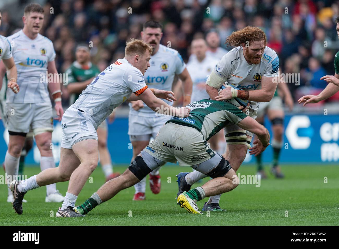 Jack Dunne of Exeter Chiefs crashes through the London Irish defence ...