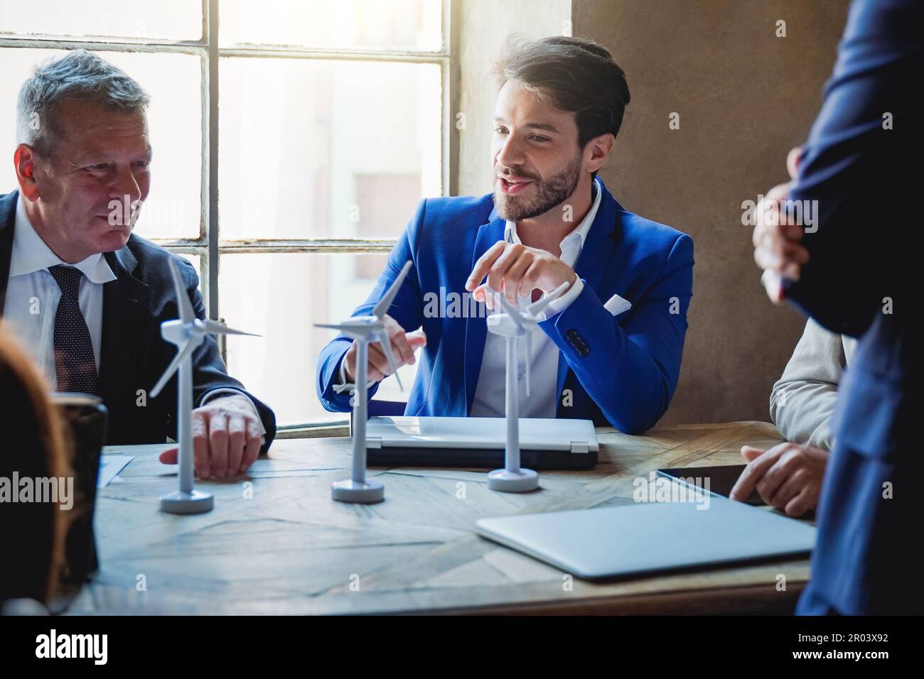 Business people working on sustainable renewable energy project inside ...