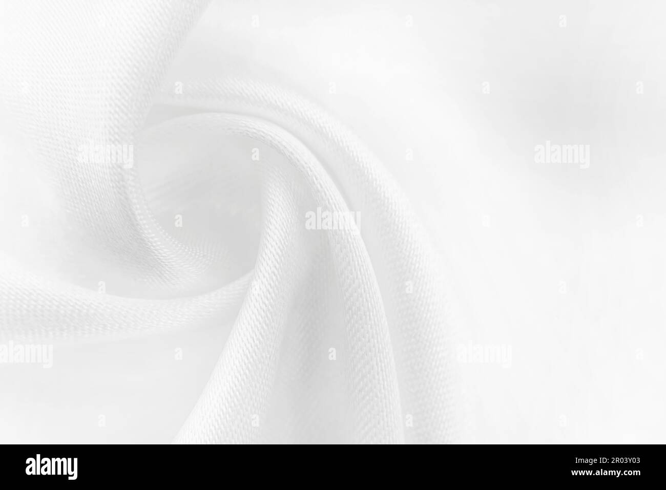 A twisted piece of white fabric. White material or texture with waves ...