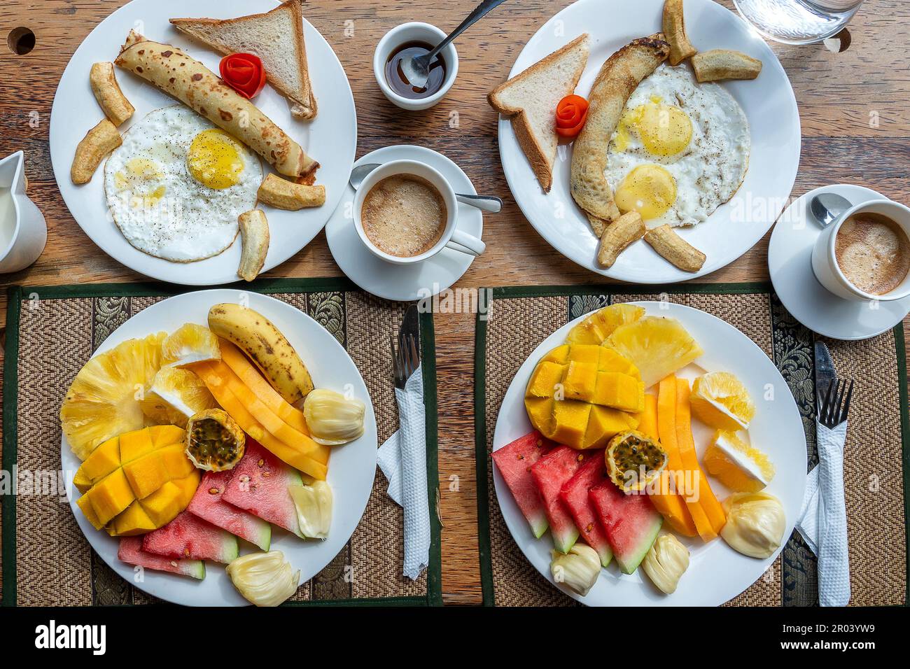 Tropical breakfast of fruit, coffee and scrambled eggs and banana ...