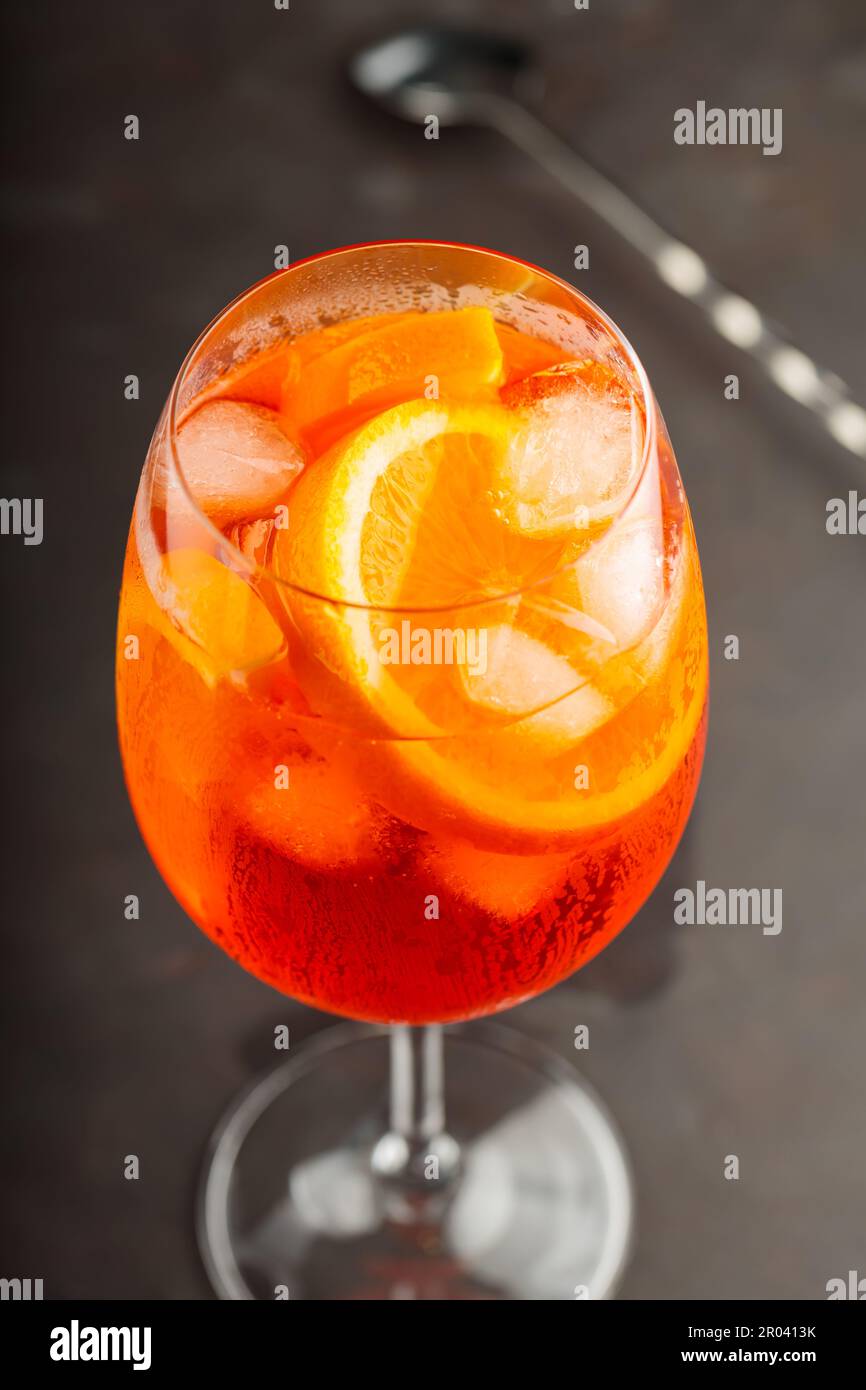 Classic italian aperitif Aperol Spritz cocktail with slice of orange on ...