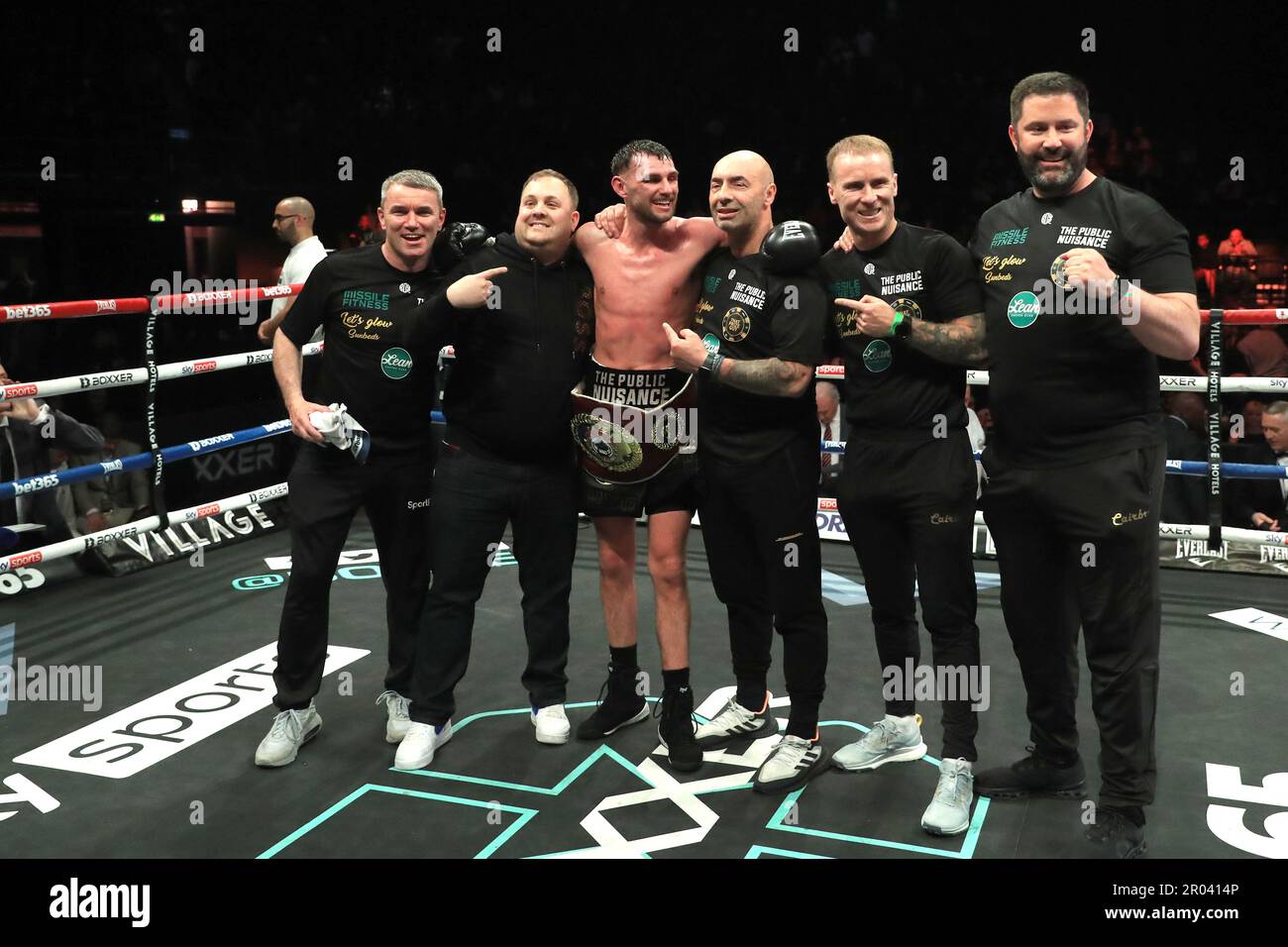 Sean McComb (centre) celebrates with his team after winning the WBO ...