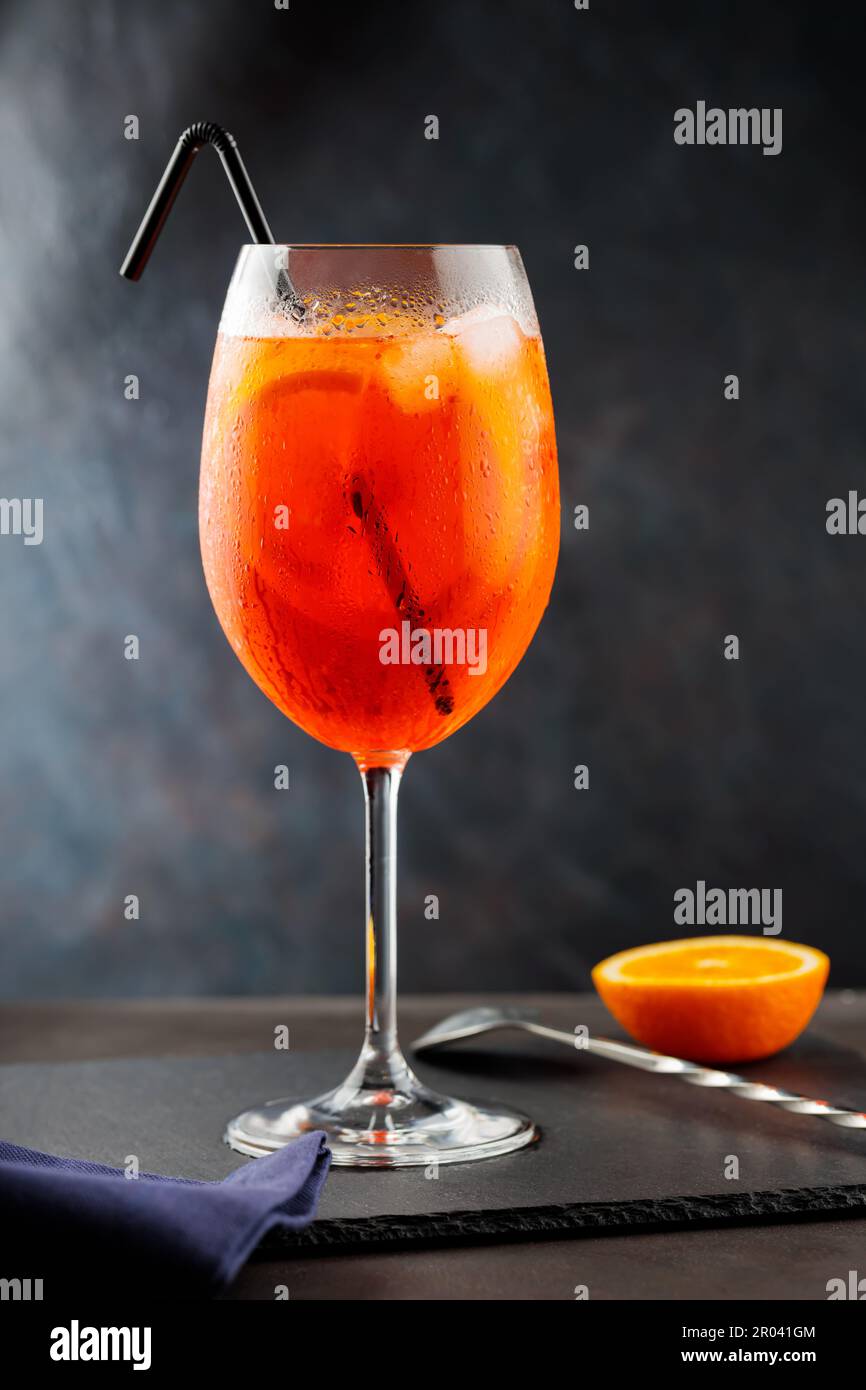 Aperol spritz cocktail and steel bar tools on slate board. Cocktail ...