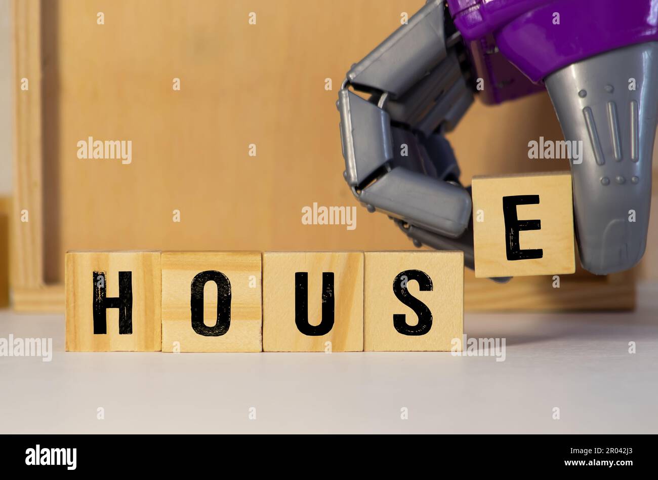 word house written in small wooden alphabet cubes on isolated white ...