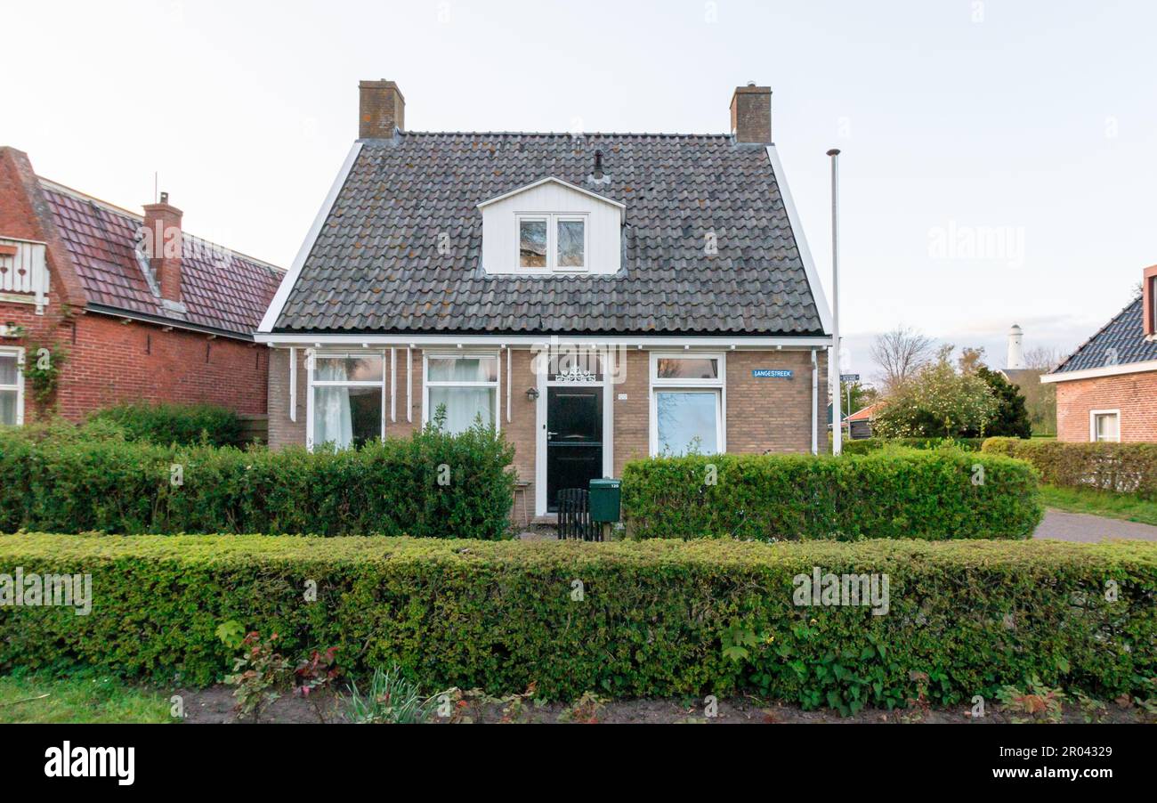 a row of old Dutch traditional houses on the wadden island of ...
