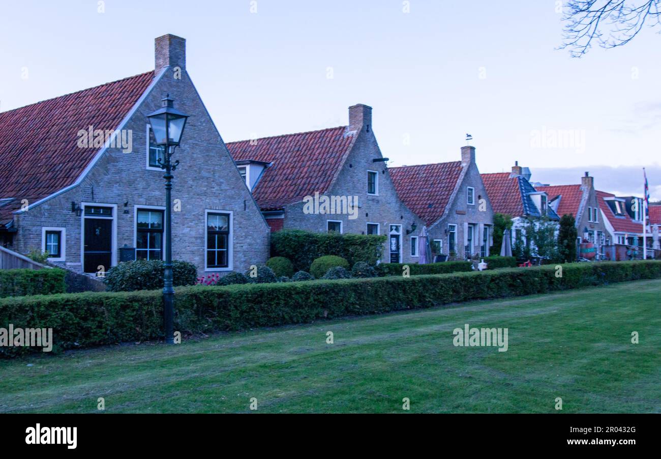 a row of old Dutch traditional houses on the wadden island of ...