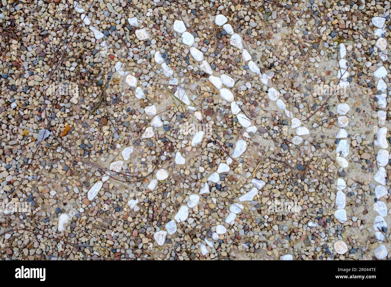 small white stones laid out on the path. directions in the form of ...