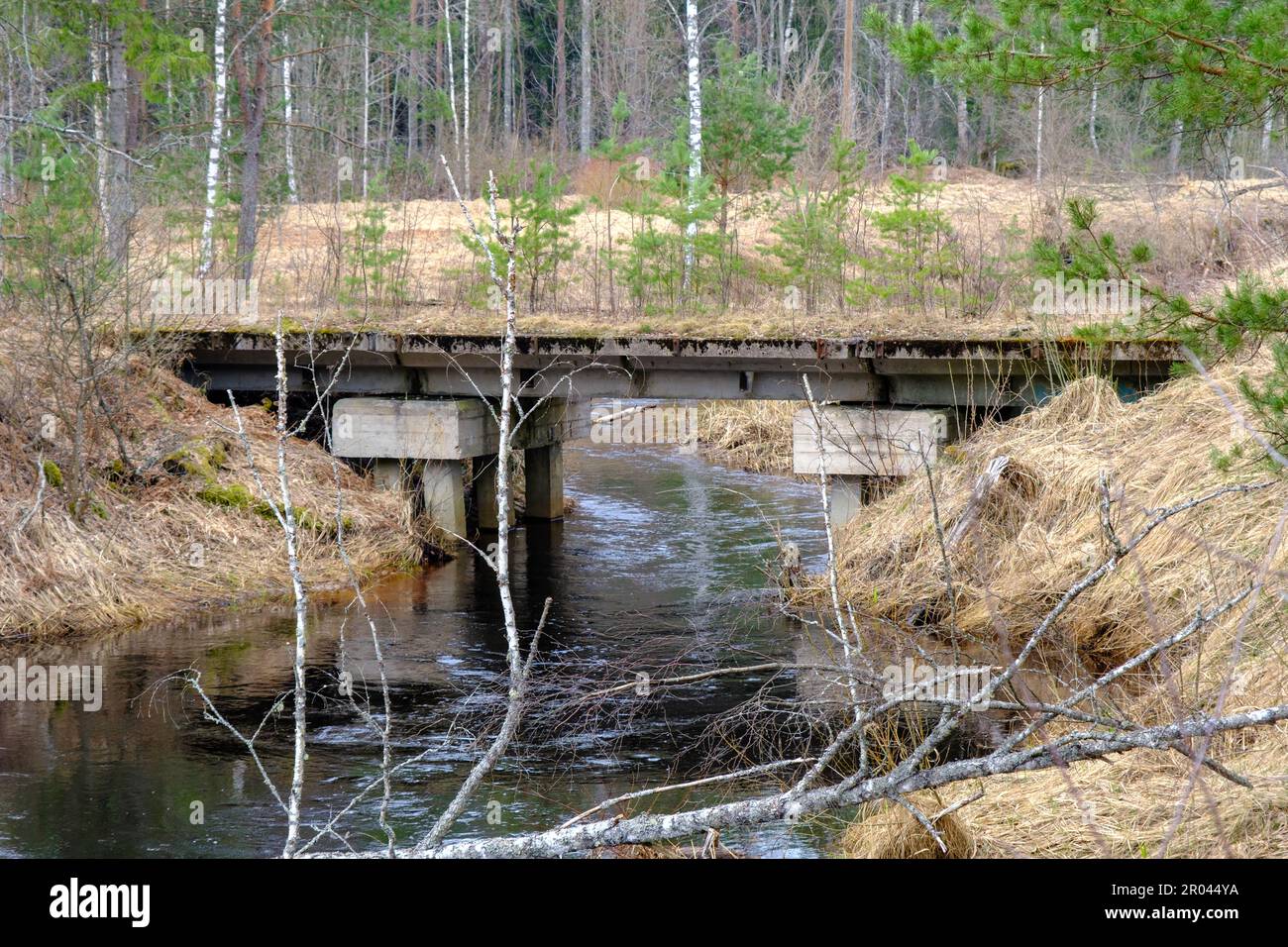 an old concrete bridge over a small river. Narrow gauge railway bridge ...