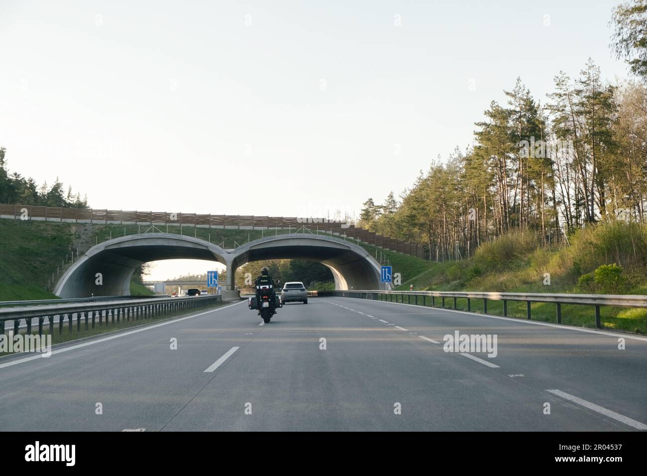 Police unit on byke drive after suspecteful car without vehicle ...