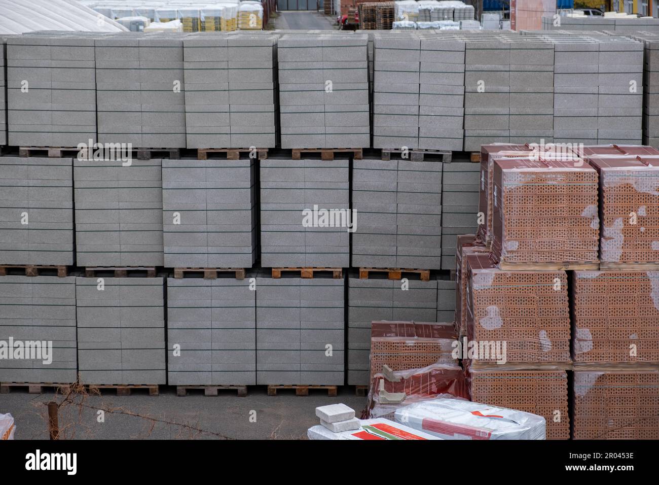 A lot of Pallets of Concrete Cinder and ceramic Blocks, Grey Uniformed brick Shapes building ...