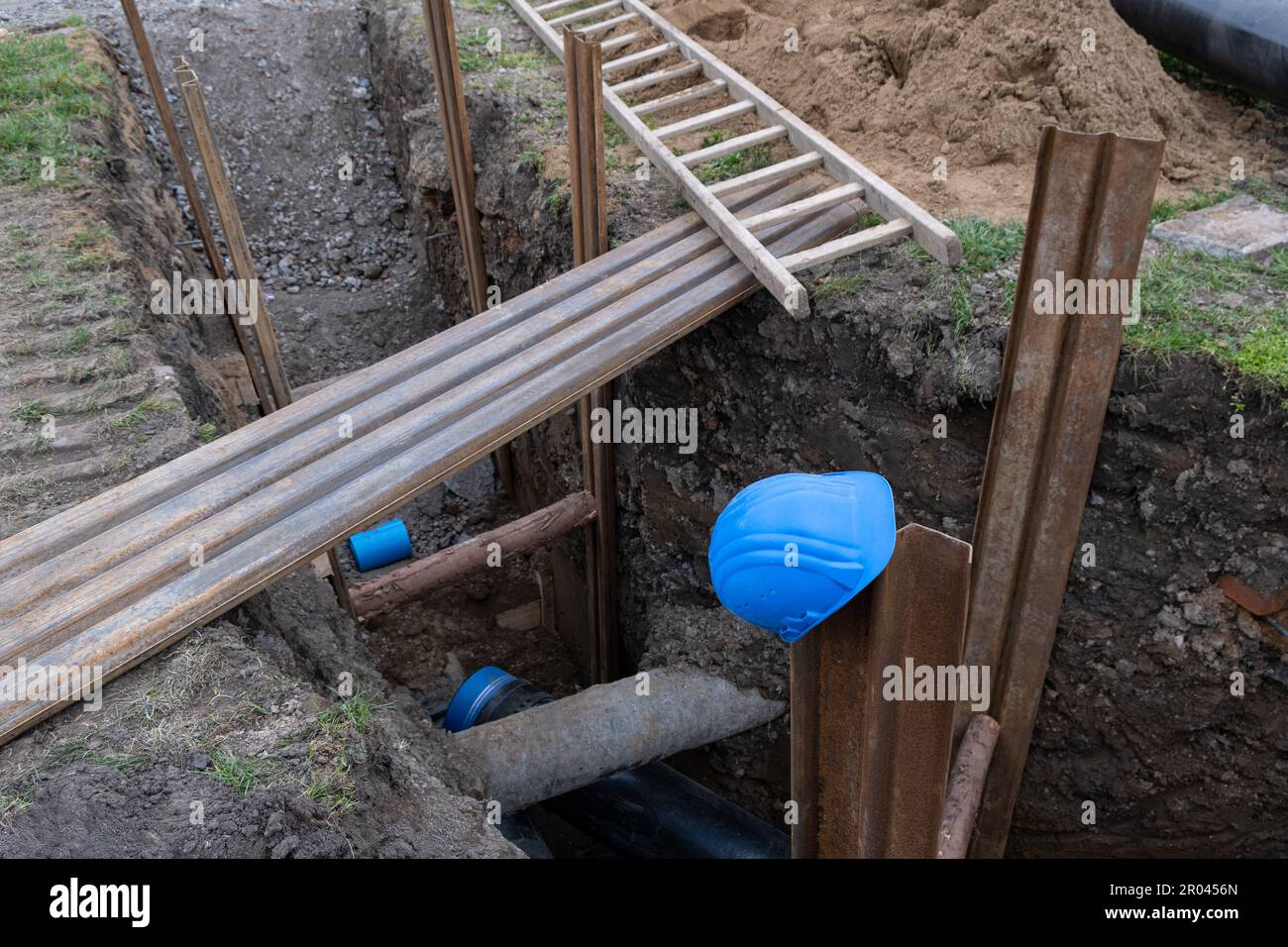 buried underground on the street Deep installation of drink water pipe ...