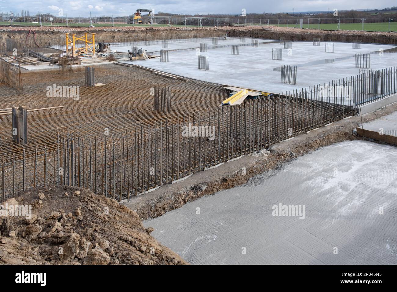 Beginning Laborers work Concrete pillars on the construction site ...