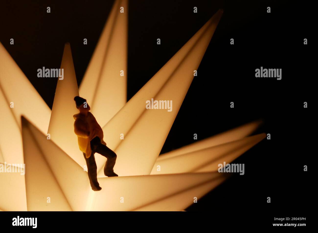 little man standing and relaxing on a moravian star Stock Photo - Alamy