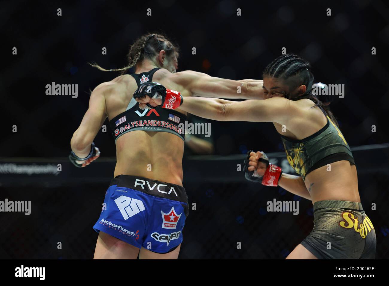 DENVER, COLORADO - MAY 5: (L-R) Alyse Anderson lands a spinning back ...