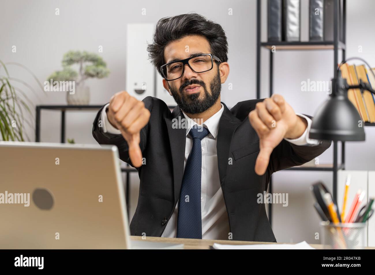 Serious dissatisfied indian man hi-res stock photography and images - Alamy